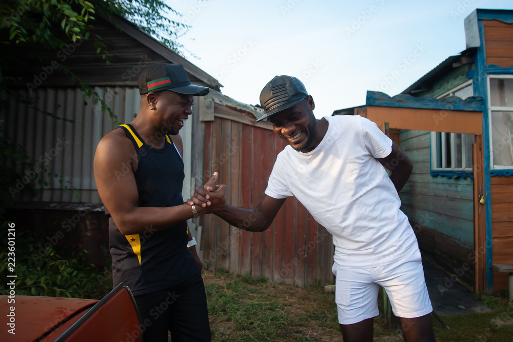 Two Black People Shaking Hands