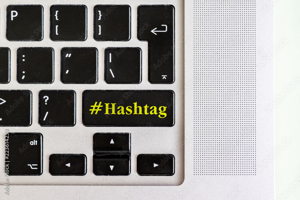top view isolated laptop keyboard with yellow "hashtag" text on button ...