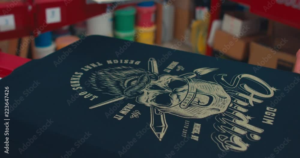 Silk screen printing process - making a print on a t-shirt. 4K UHD ...