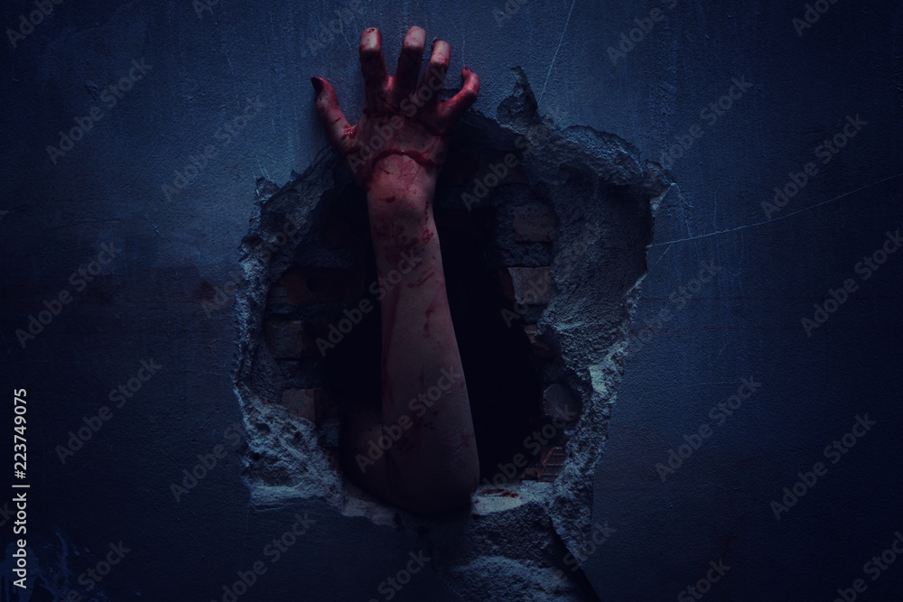 Horror Scene with bloody hand of evil is coming from a dark hole. Stock ...
