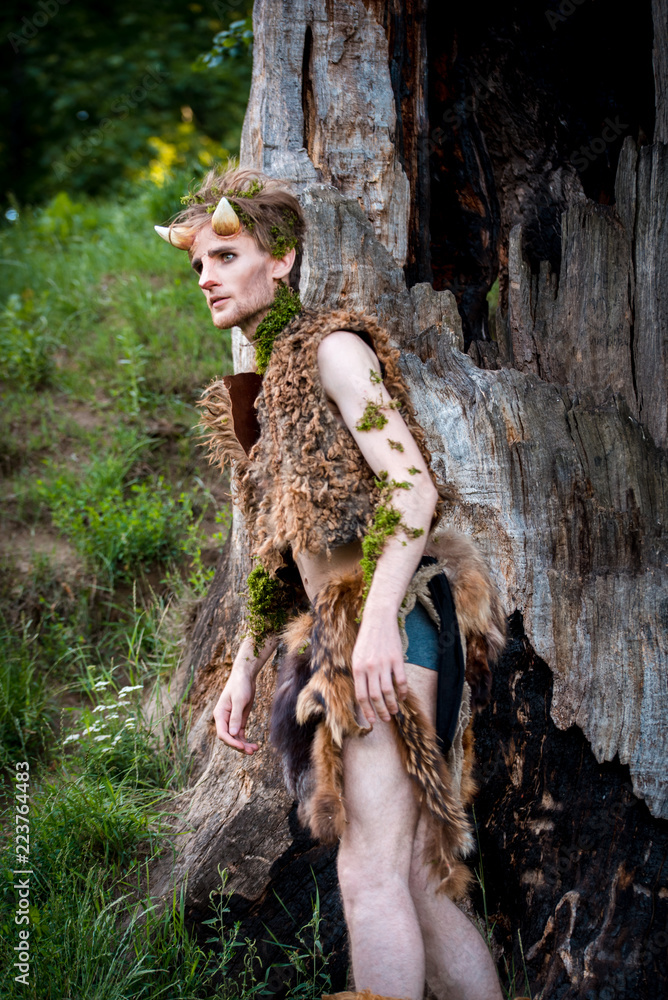 Young couple of elves in love standing in magical forest outdoor on ...