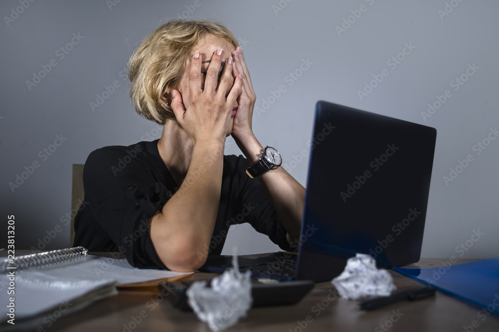 young frustrated and stressed business woman crying sad at office desk ...