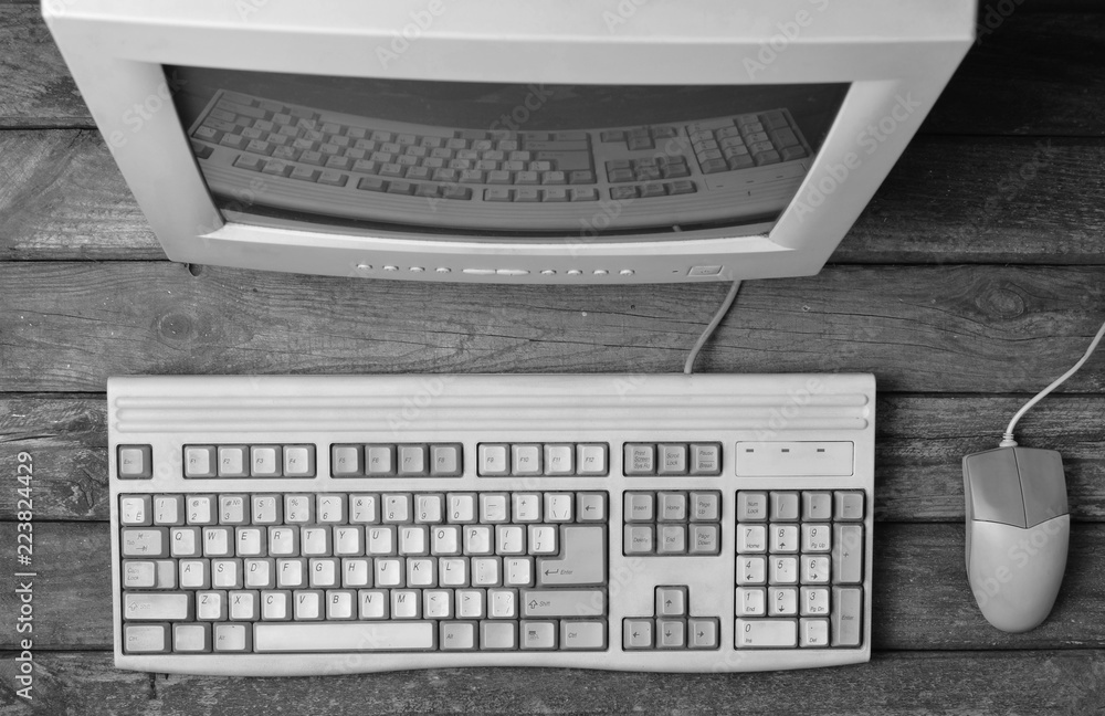 Foto de Retro stationary computer on a rustic wooden desk, vintage ...