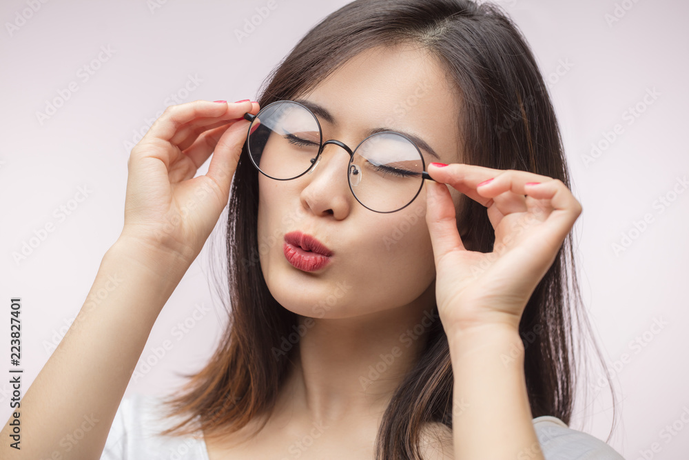 happiness, health and vision concept - joyful young asian woman ...