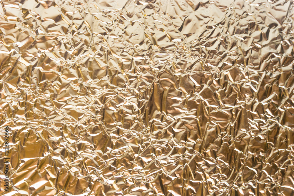 Gold wrinkled food foil background texture, crumpled yellow foil ...