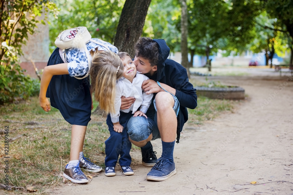 Older Brother And Sister Hugging