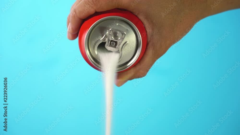 Stockvideo Hand holding soda can pouring lots of sugar in metaphor of ...
