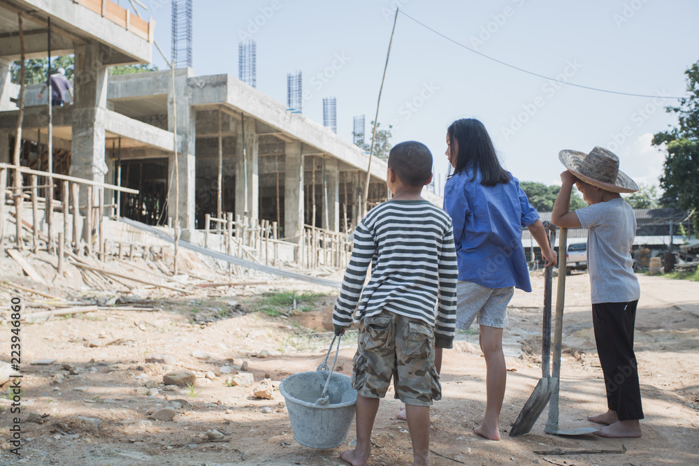 Image blur, Poor children working at construction site against children labour, World Day ...