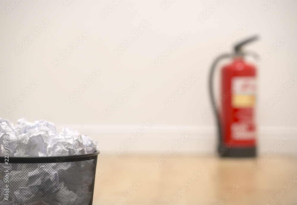 LITTER BIN FULL OF CRUMPLED WASTE PAPER ON WOOD OFFICE FLOOR WIT Stock ...