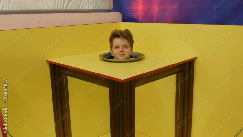 Teenager boy shows a magical focus of an illusion of a body without a ...