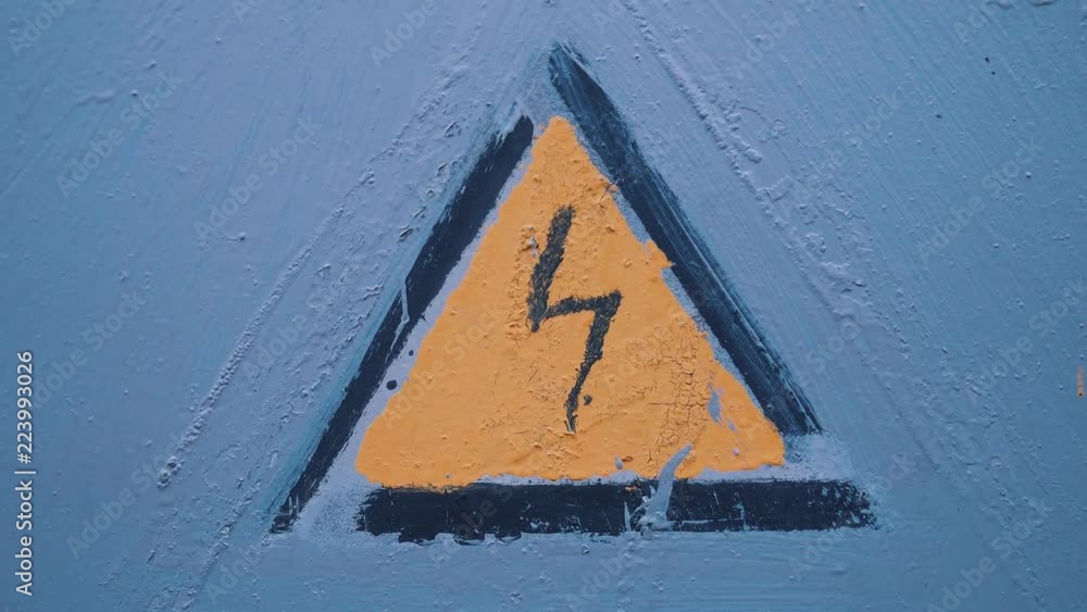 danger electricity sign. Grungy high voltage sign over blue wall ...