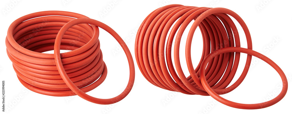 Set of orange hydraulic and pneumatic o-ring seals isolated on a white ...