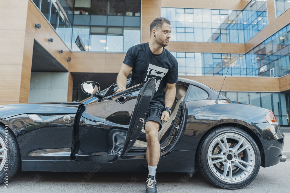 Guy Stepping Out Of Car