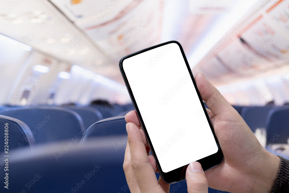 Foto de Airplane passenger using smart phone on plane. Businessman ...