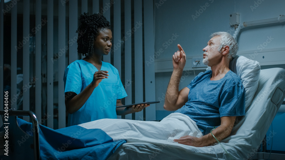 In the Hospital, Senior Patient Lying in the Bed Nurse Holding Tablet ...