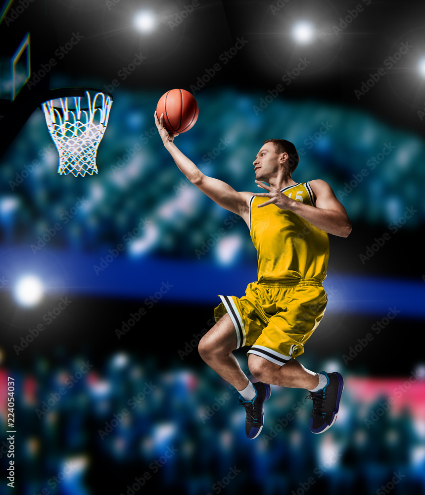 Foto de basketball player making slam dunk on basketball arena do Stock ...