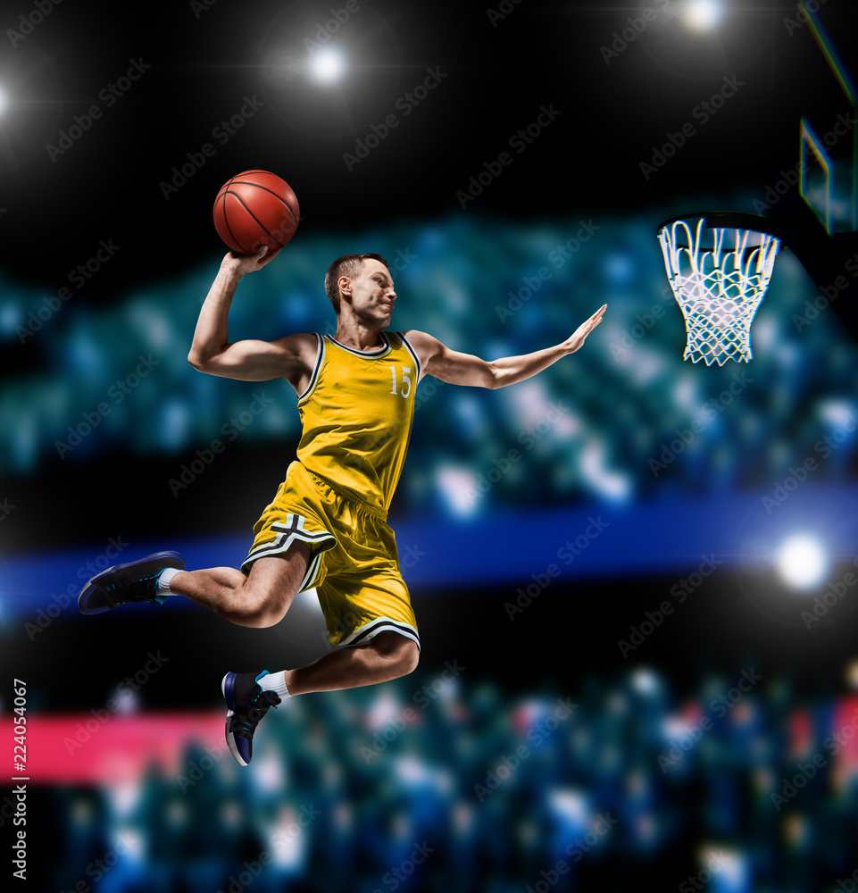 basketball player making slam dunk on basketball arena Stock Photo ...