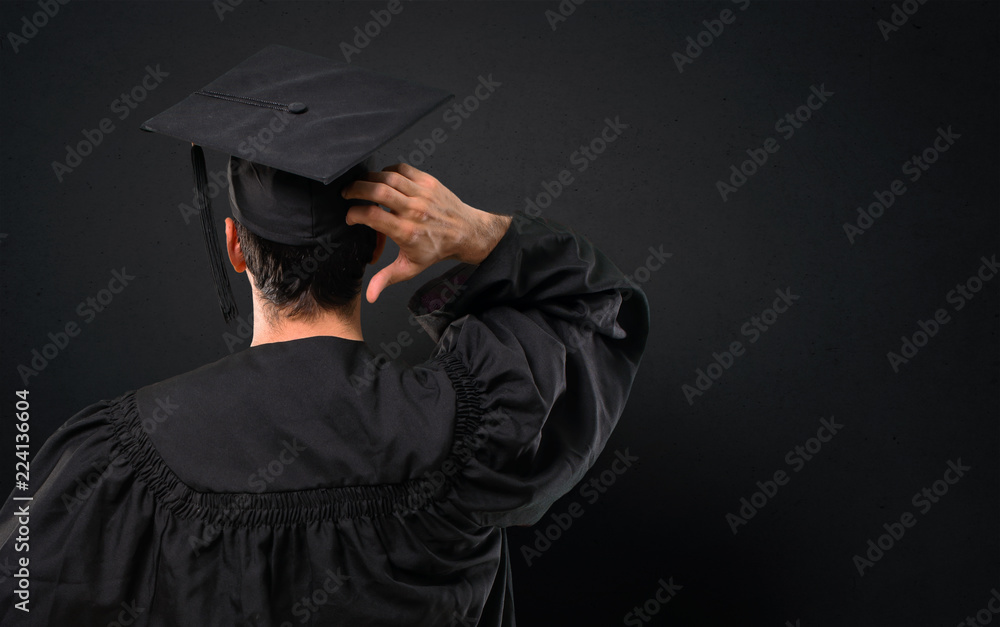 Man on his graduation day University on back position looking back ...