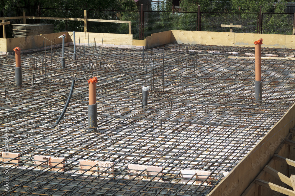 reinforcement of concrete with metal rods connected by wire ...