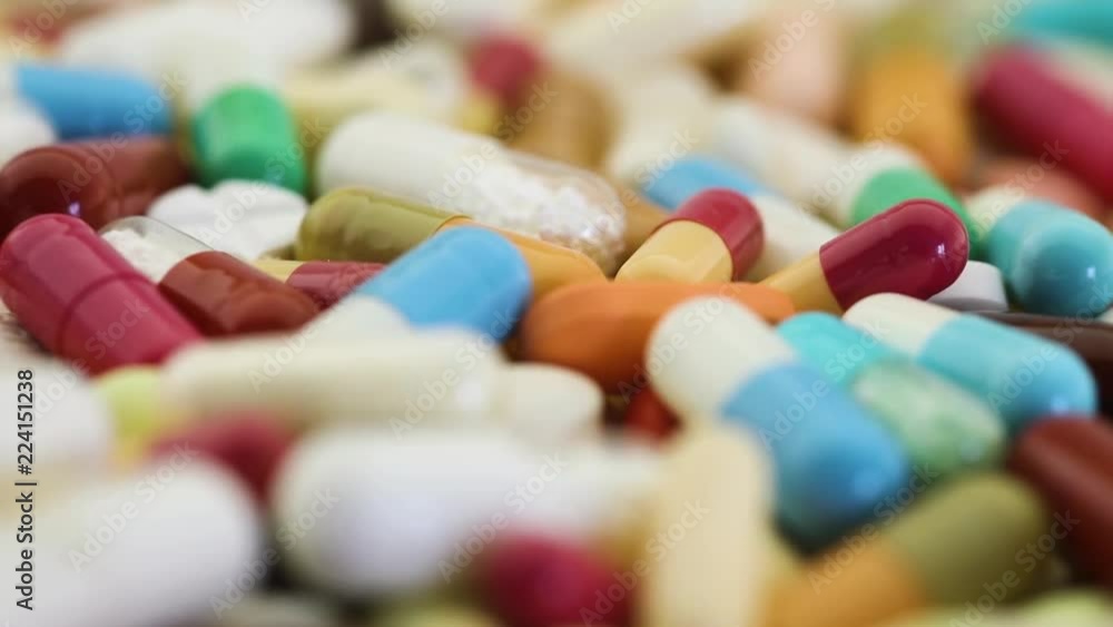 Closeup shot of various pills spinning through view Stock Video | Adobe ...