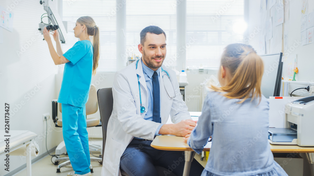 Little Girl Visits Doctor's Office. Friendly Pediartrist Talks with ...