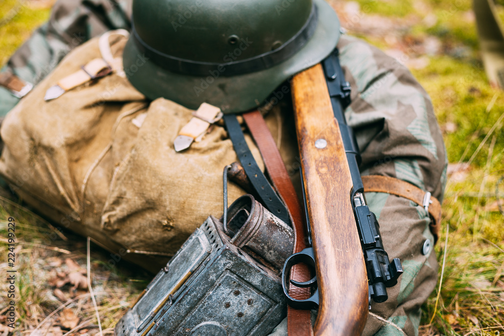 German Ammunition Of World War II On Ground. Military Helmet, Li Stock ...