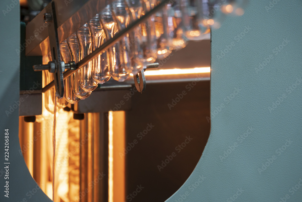 The preform shape of plastic bottles in the heater for manufacturing ...