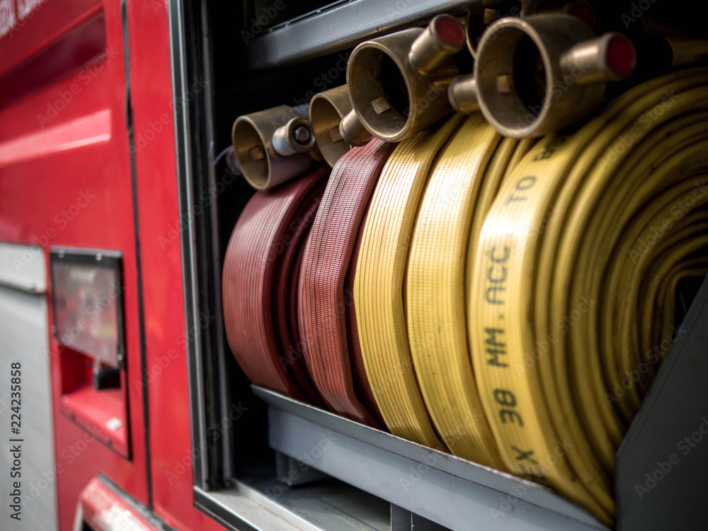 Fire hose rolled with connections Stock Photo | Adobe Stock