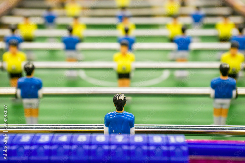 Table football game, Soccer table with yellow and blue players. Soccer ...