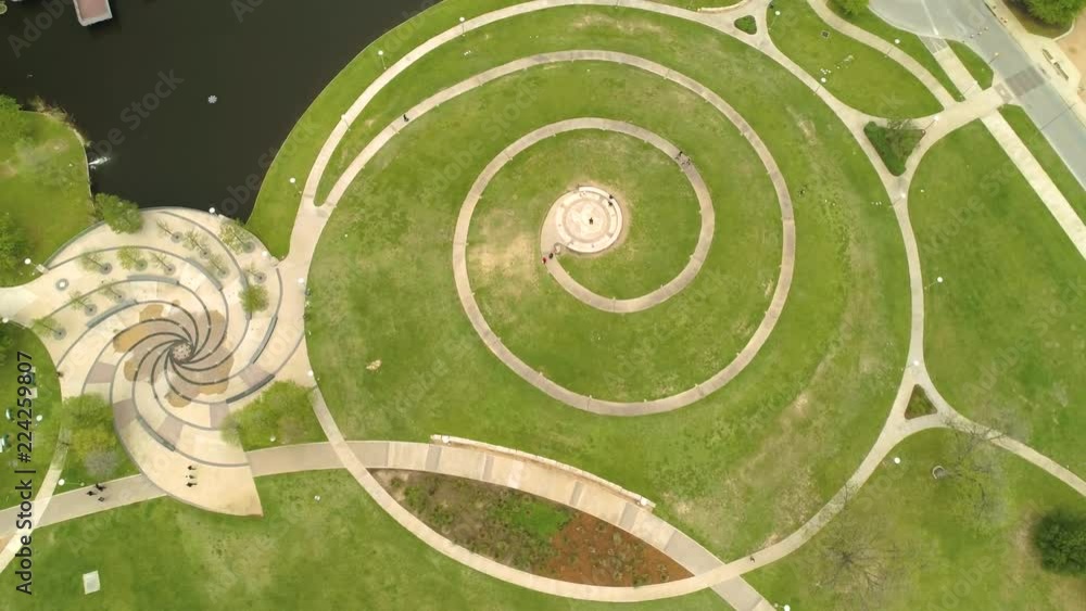 Aerial in Austin, Texas, above Butler Park, rotating right and ...