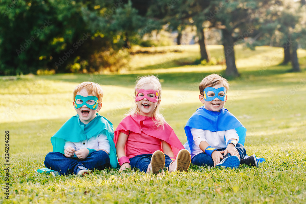 Cute adorable preschool Caucasian children playing superheroes. Three ...