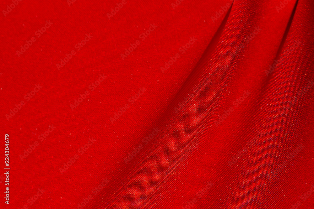 Texture of gabardine tissue. Red cloth gabardine creates a background ...