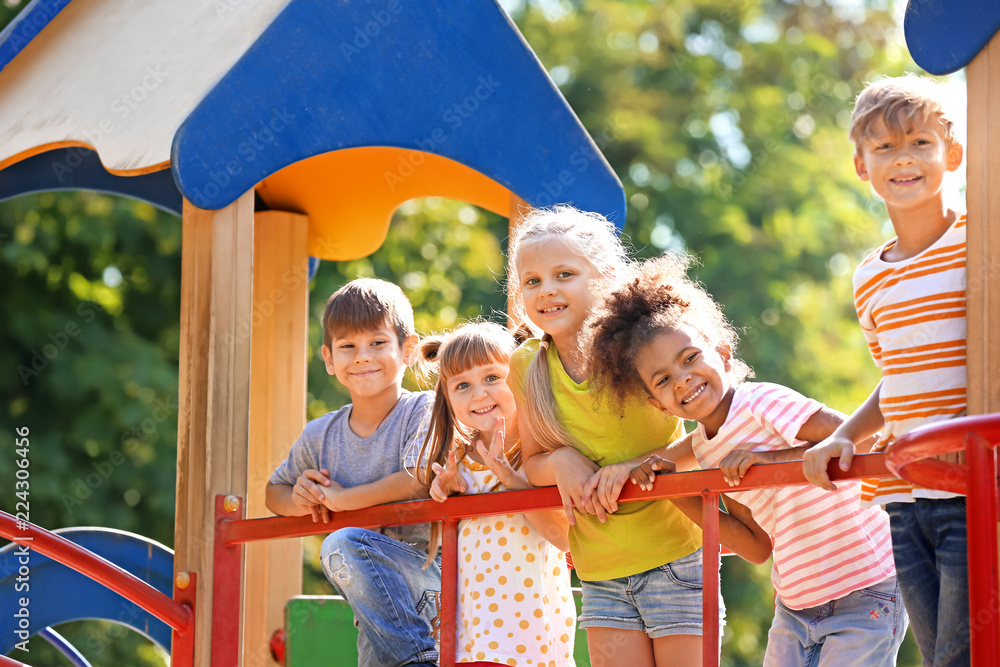 Cute little children having fun on playground outdoors Stock Photo ...