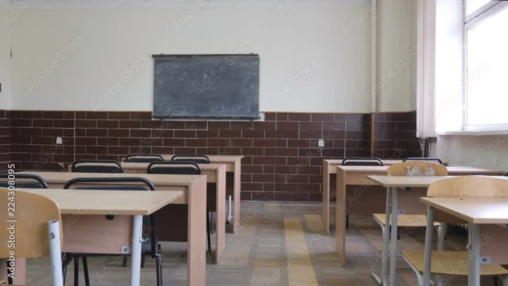 Empty study hall in High school, College. Camera moving to chalkboard ...