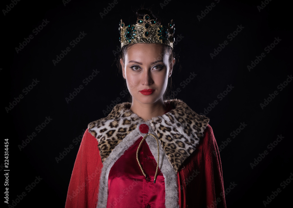 queen with crown, studio portrait on a black background Stock Photo ...