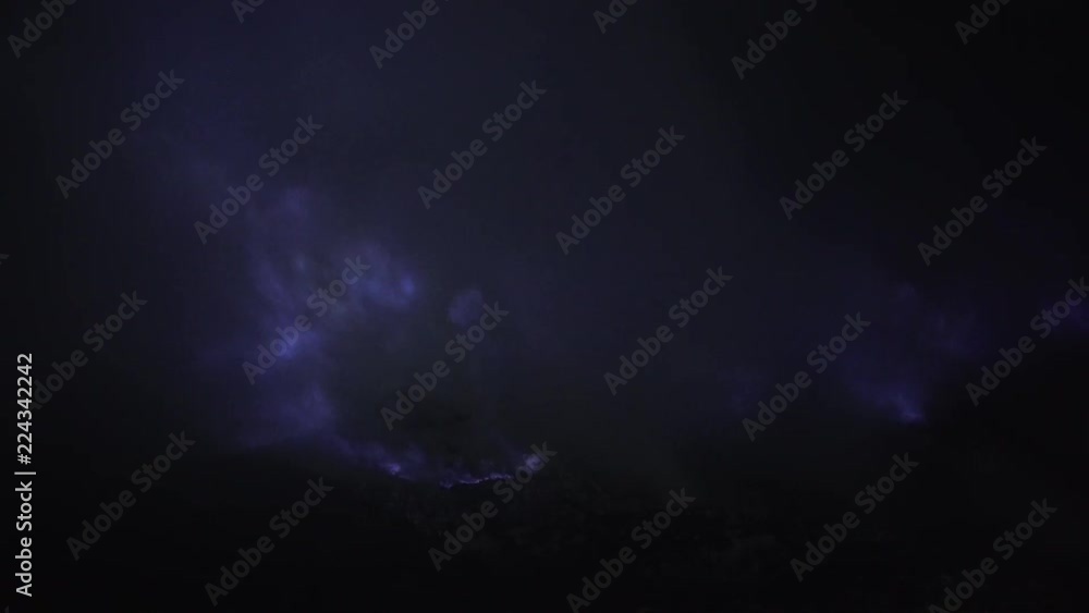 Blue fire of burning sulfur in a crater of a volcano Kawah ijen, Java ...