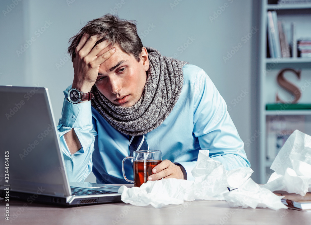 Bad feeling. Sick worker has high temperature. Photo of young man in ...