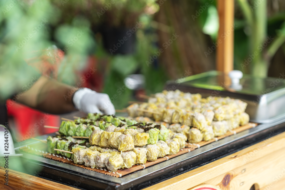 Dim sum on stick ready to eat in street food market in bangkok thailand ...