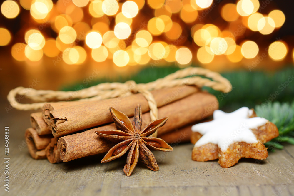 Cinnamon sticks as a spice for Christmas with fairy lights as ...