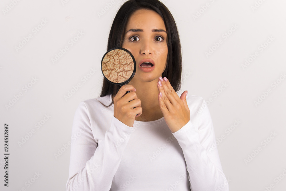 beautiful girl with perfect skin commercial face type holding magnifier ...