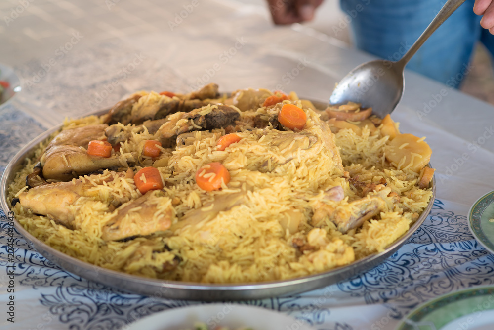 Maqluba traditional Arab food.The dish includes meat, rice, and Stock ...