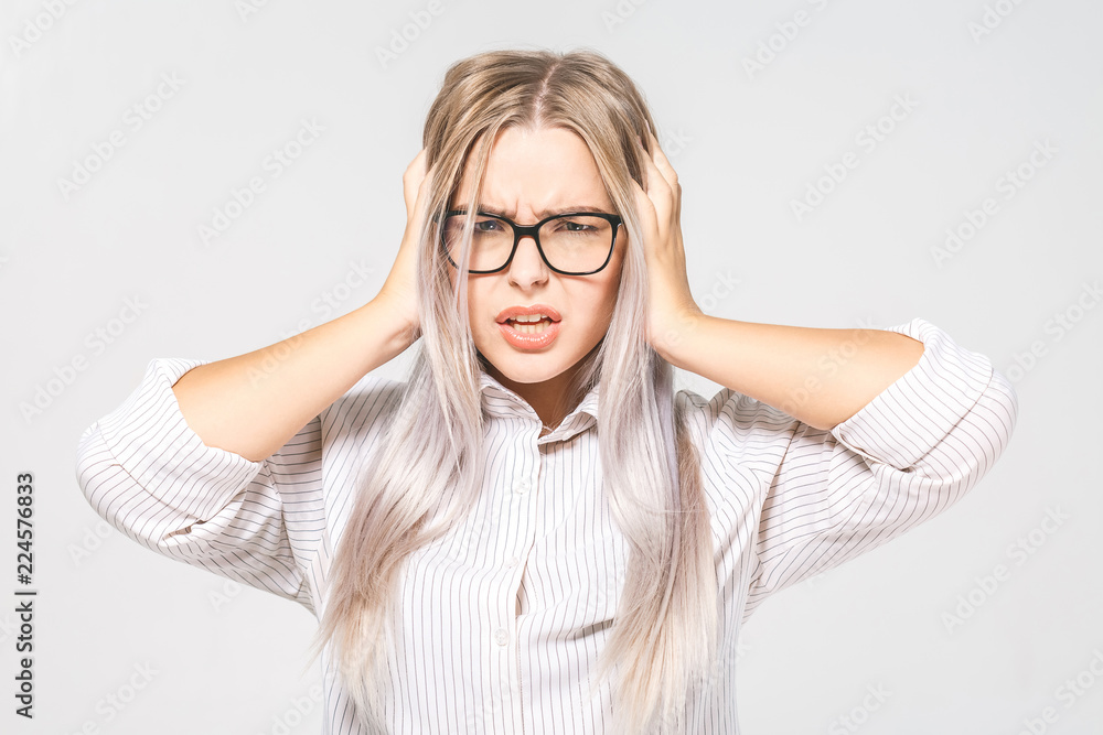 Close up isolated portrait of young annoyed angry woman holding hands ...