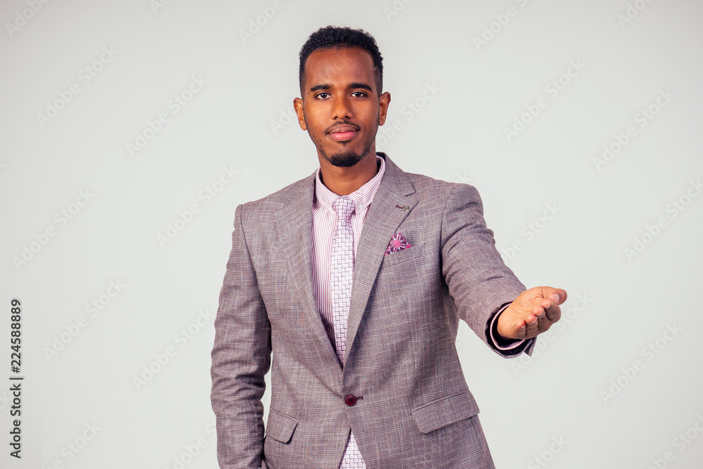African-American businessman gives a hand for a handshake. Business ...