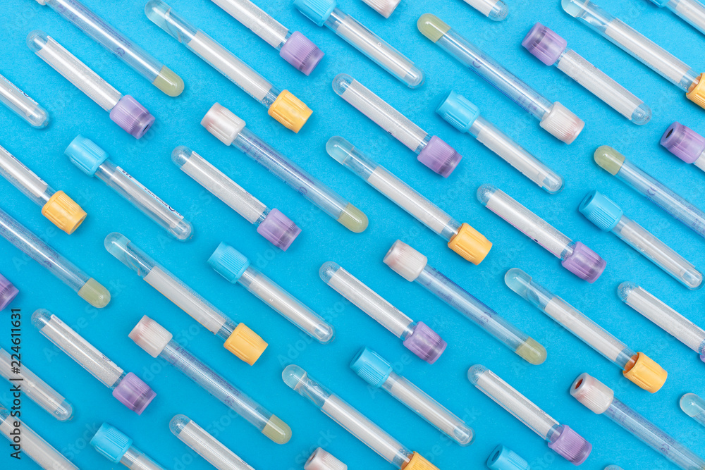 close-up medicine test tubes blood for blue background. Flat lay, top ...