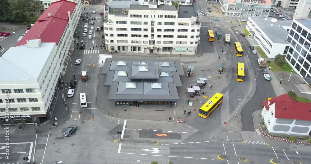 Bus station in Reykjavik. Three yellow buses arrive and leave. Stock ...