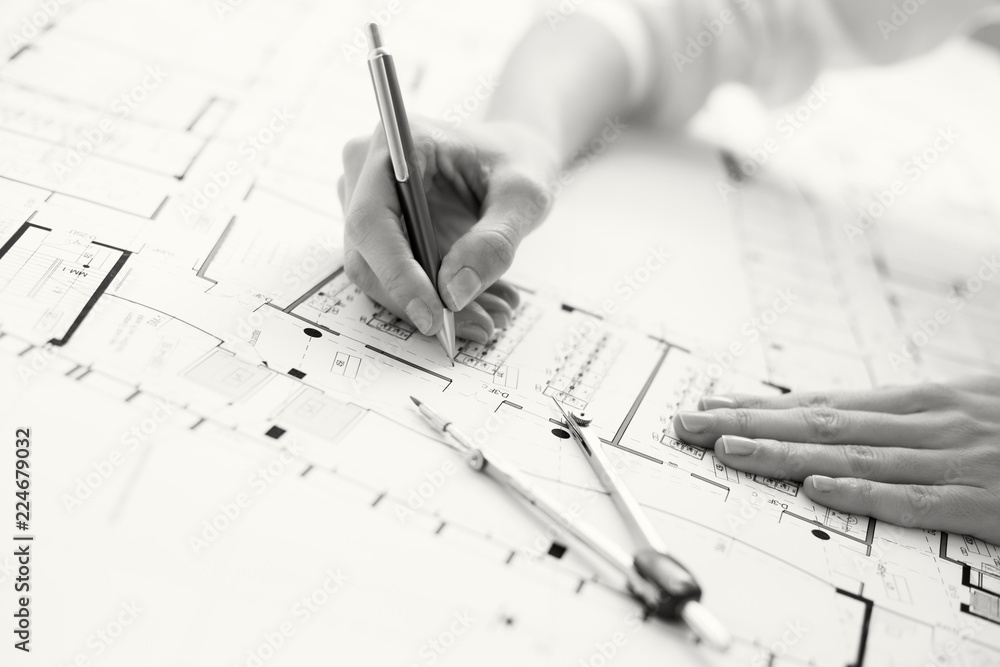 Black and white photo of architect working on house plan Stock Photo ...