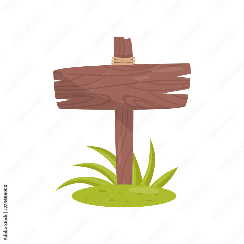 Old wooden road sign standing on the grass, direction sign board ...