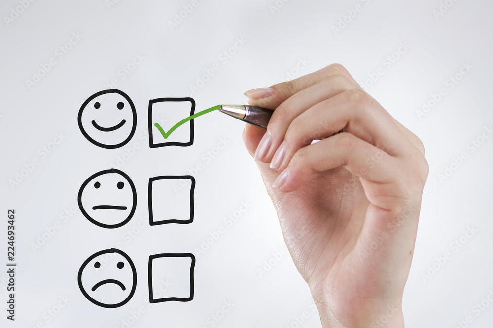 Hand putting check mark with green marker on customer service ...