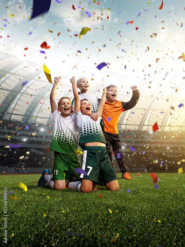 winning football player Children after score in a match confetti and ...