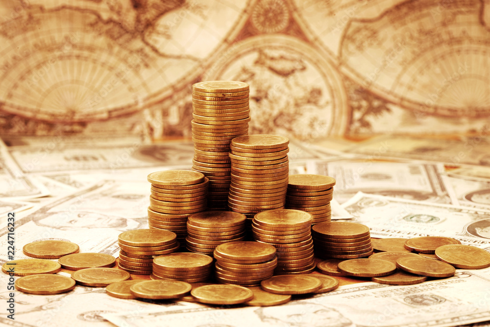 Capitalism concept : Coin stack on bank note and vintage map background ...